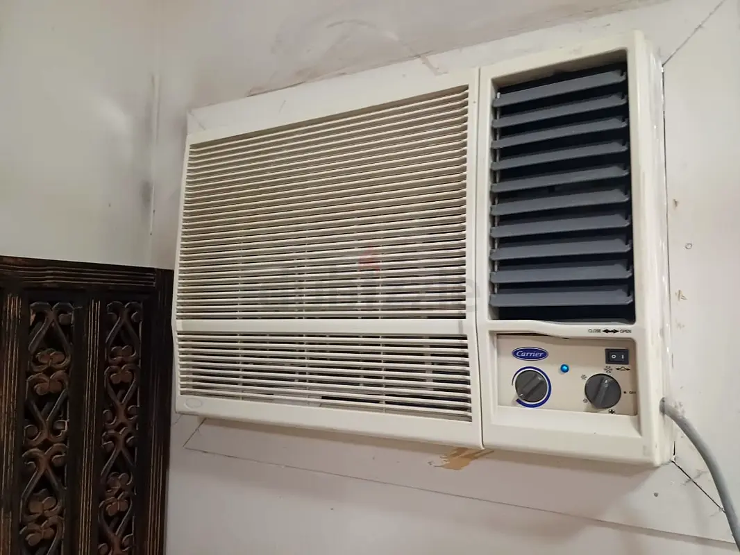 Carrier window AC with a 2-ton capacity and large piston compressor for ...
