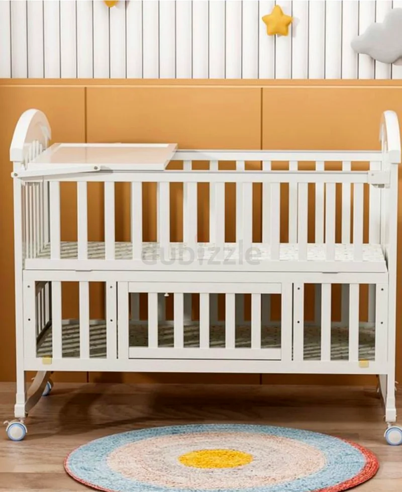 Solid Wood convertible Baby Crib with storage Wheels 3 in 1. Sold with ...