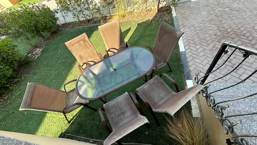 Elegant Outdoor Glass Dining Table set with 6 Chairs | dubizzle Abu Dhabi