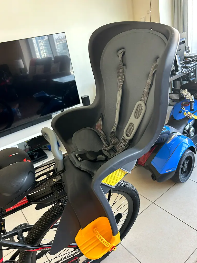mountain bike with a rear-mounted child seat. | dubizzle Dubai