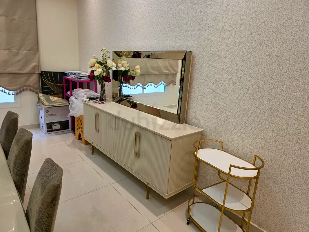 Modern Elegance: Glass Top Dining Table with Plush Chairs | dubizzle UAE