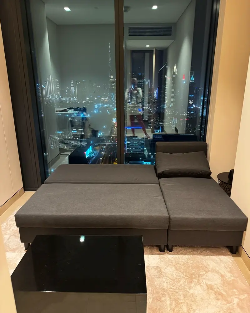Grey Sofa Bed with coffee table and carpet | dubizzle Dubai