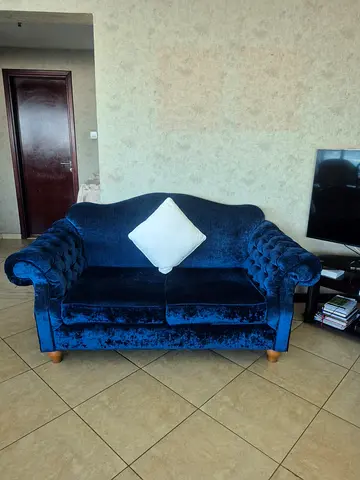 Classifieds: Two-seater blue velvet tufted sofa — good condition with 2 ...