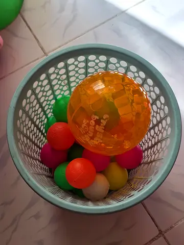 Classifieds: A bi g crystal bouncy ball with many colorful balls and ...
