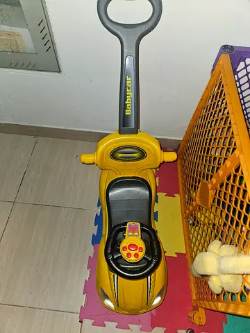 Classifieds: Child’s yellow ride-on push car with handle - good ...