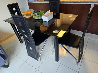 Classifieds: Black glass dining table with 4 modern chairs | dubizzle ...