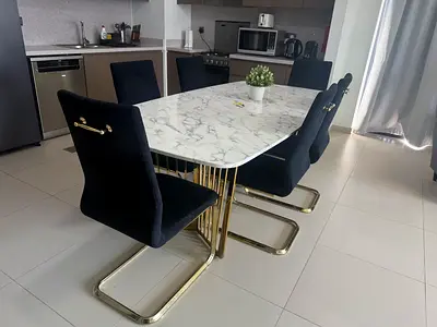 Classifieds: Marble-top dining table with 6 black velvet cantilever ...