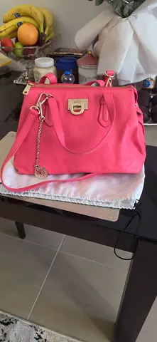 Classifieds: Pink leather-look handbag with gold hardware DKNY ...