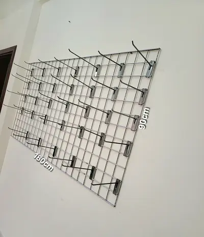 Classifieds: Wall-mounted metal grid display panel with 38 hooks ...