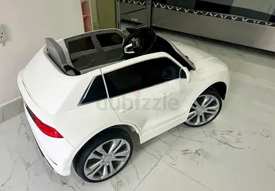 Classifieds: White electric ride-on toy car for kids - good condition ...