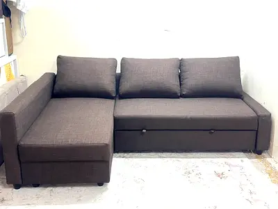 Classifieds: L-shaped brown fabric sofa-bed with storage chaise ...