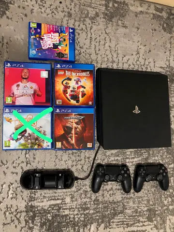 Classifieds: PlayStation 4 pro with 2 Controllers, Charging Dock and 5 ...