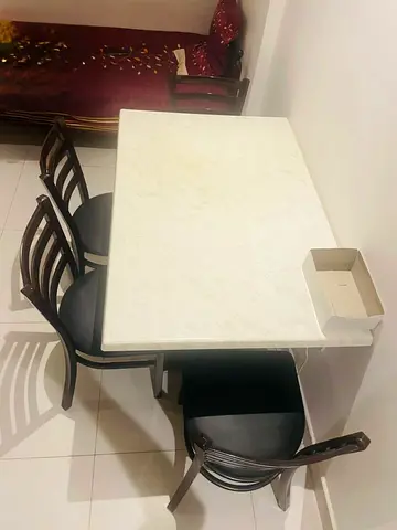 Classifieds: Compact white marble-top dining table with 4 chairs ...