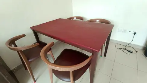 Classifieds: Solid wood dining table with four curved wooden chairs ...
