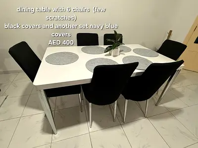 Classifieds: White dining table with 6 chairs (chair covers included ...