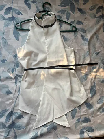 Classifieds: White Sleeveless High Neck Blouse with Thin Black Belt ...
